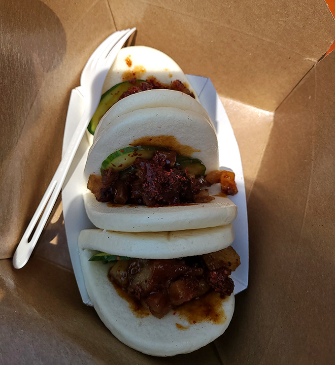These bao buns aren't just food—they're pillowy clouds of joy cradling perfectly braised meat and fresh vegetables. Worth every mile of the drive.