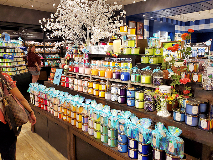 A rainbow of scented candles creates a sensory explosion that makes choosing just one like picking a favorite child.