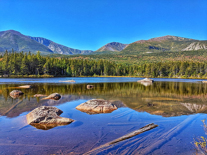 Mother Nature showing off again. Baxter State Park's pristine waters mirror the mountains with such perfection, it's like seeing double after a Maine craft beer.