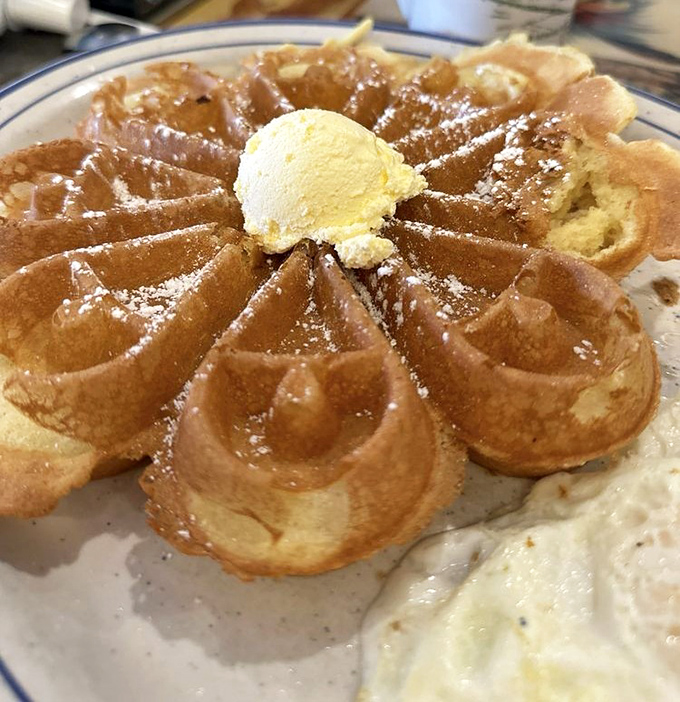 This Belgian waffle isn't just breakfast, it's architecture&mdash;golden peaks and valleys crowned with a melting scoop of butter.