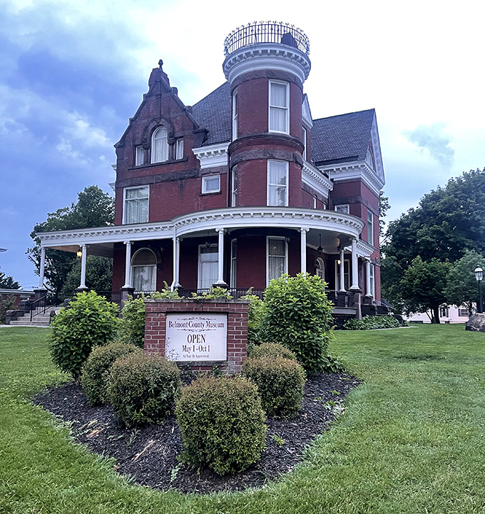 The Belmont County Victorian Mansion Museum stands like a brick-and-mortar wedding cake, complete with that tower that screams, "Yes, I was built when architecture had personality!"