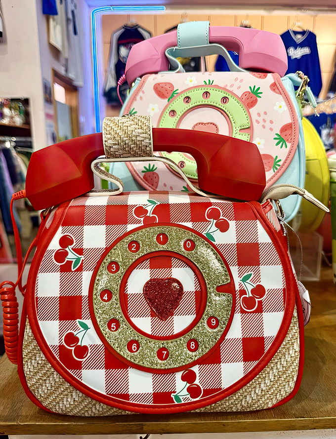 Novelty handbags that double as time machines. That cherry-print rotary phone purse isn't just an accessory&mdash;it's a statement that says, "I remember life before texting."