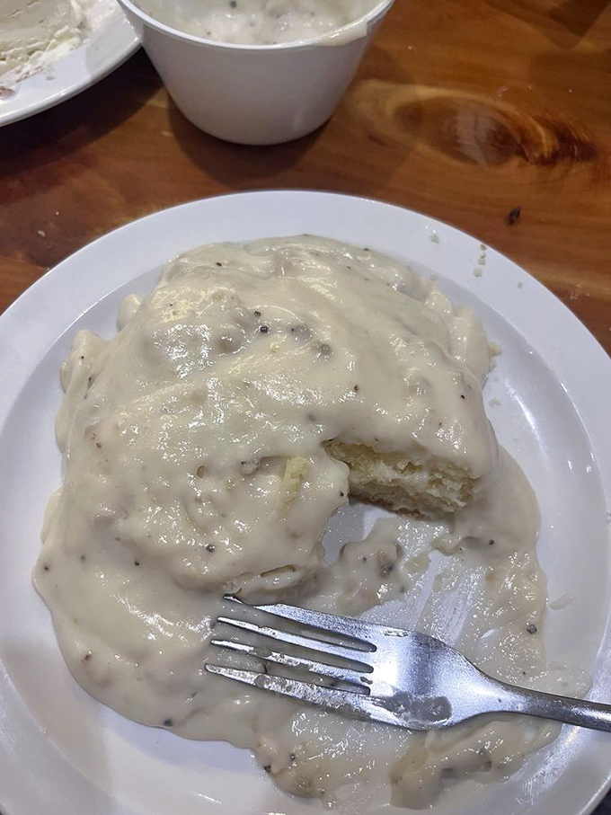 Biscuits and gravy so decadent they should require a permission slip. That pepper-speckled gravy blanket is comfort defined.