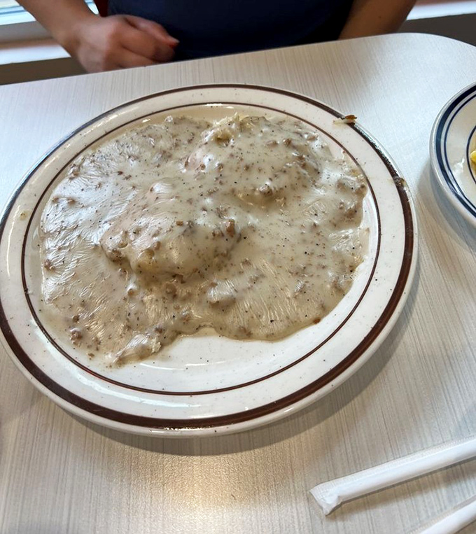 This isn't just gravy; it's a creamy river of possibility with islands of sausage waiting to be explored.