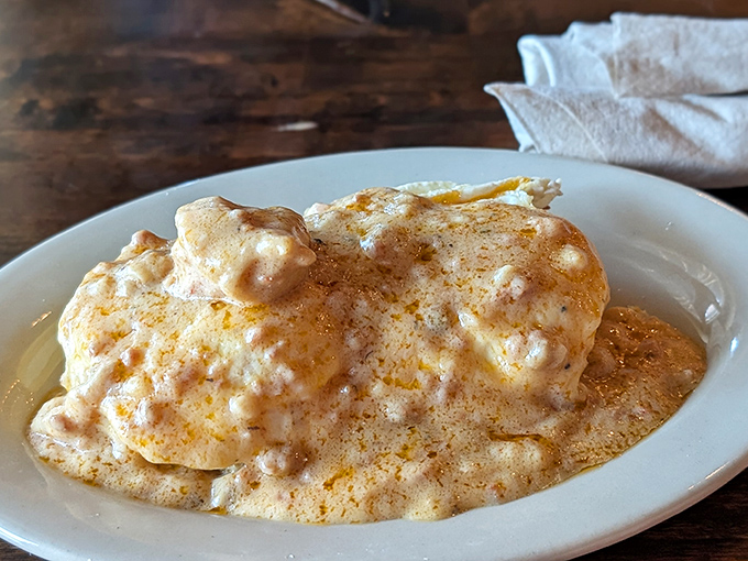 These aren't your grandmother's biscuits and gravy (unless your grandmother was secretly a five-star chef)&mdash;creamy, peppery perfection atop split, griddled clouds of dough.