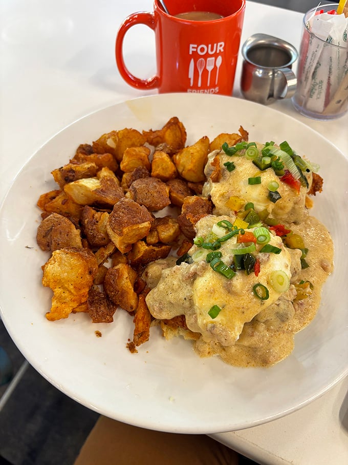 Biscuits and gravy that would make your Southern grandmother weep with joy, paired with potatoes so perfectly crispy they deserve their own fan club.