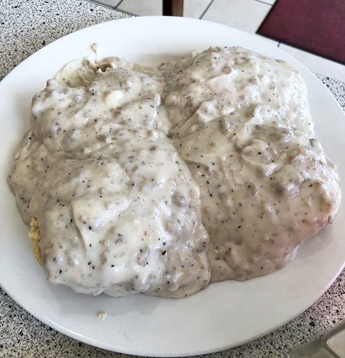 Behold the holy grail of comfort food: biscuits smothered in pepper-flecked sausage gravy. This plate has launched a thousand food pilgrimages.