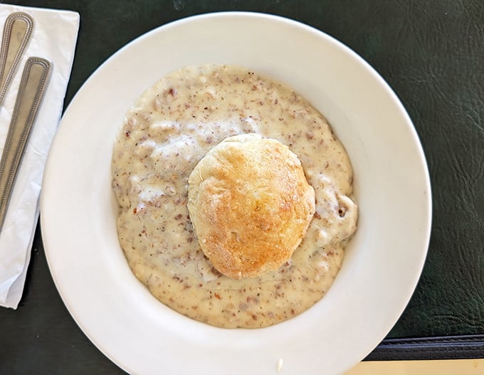 Behold, the holy grail of comfort food! This biscuit floats like an island of buttery perfection in a sea of peppery, sausage-studded gravy.