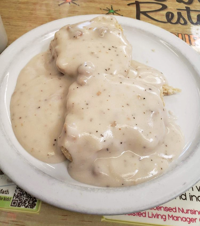 Behold the star attraction: biscuits drowning in peppery sausage gravy. Not diet food, but worth every glorious, soul-satisfying calorie.
