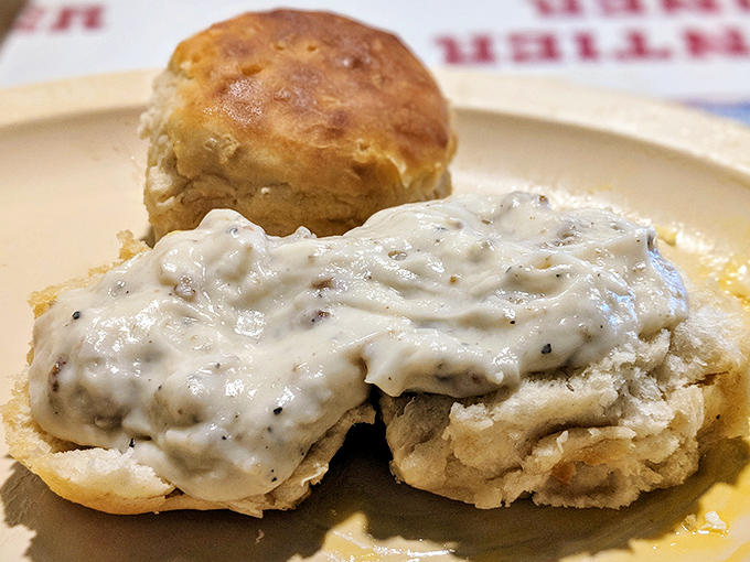 These aren't just biscuits and gravy; they're fluffy clouds of dough swimming in a peppery sea of country gravy that could convert vegetarians on sight.