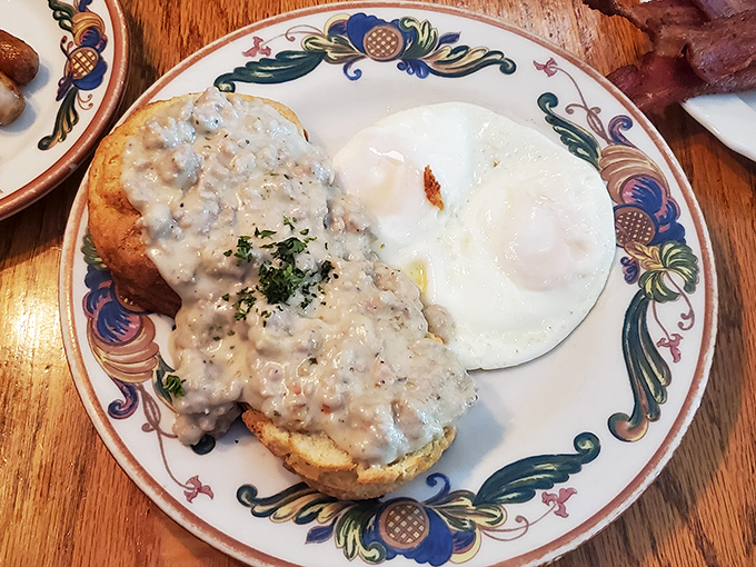 Behold the legendary biscuits and gravy &ndash; a golden throne of flaky pastry crowned with peppery sausage gravy that would make your grandmother weep with joy.