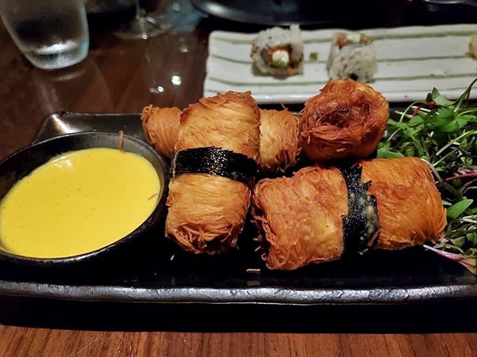 These crispy-coated black cod rolls aren't just appetizers&mdash;they're flavor grenades wrapped in golden armor, served with a dipping sauce that'll make you weep with joy.