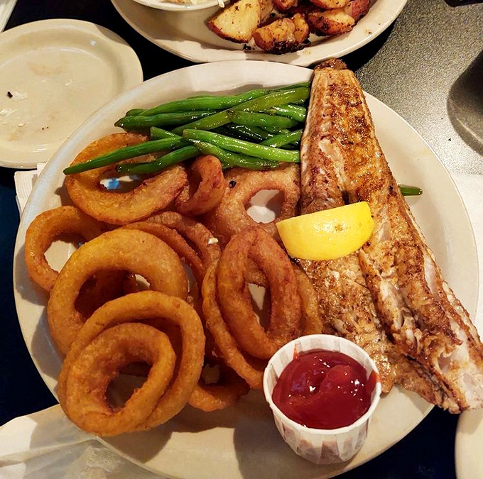 The star of the show: perfectly blackened walleye with crisp green beans and golden onion rings&mdash;a plate that makes you want to send a thank-you note to Lake Erie.