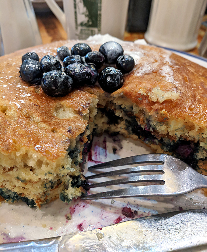 These blueberry pancakes aren't just breakfast&mdash;they're edible art where each berry creates tiny bursts of flavor against the golden canvas.