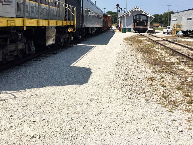 The museum grounds offer a peaceful glimpse into railroad history, where vintage equipment rests on beds of limestone ballast, waiting to share stories of America's rail heritage.