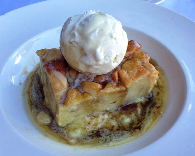 The legendary bread pudding arrives like a warm hug on a plate, crowned with melting vanilla ice cream that creates rivers of creamy goodness.