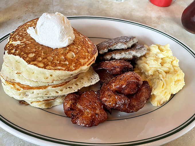 Pancakes so fluffy they need their own zip code, paired with eggs that remind you why breakfast deserves its legendary status.