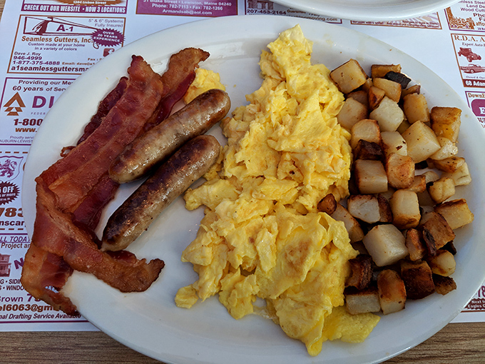 This isn't just breakfast&mdash;it's edible architecture: golden eggs, crispy home fries, and meat working in delicious harmony.