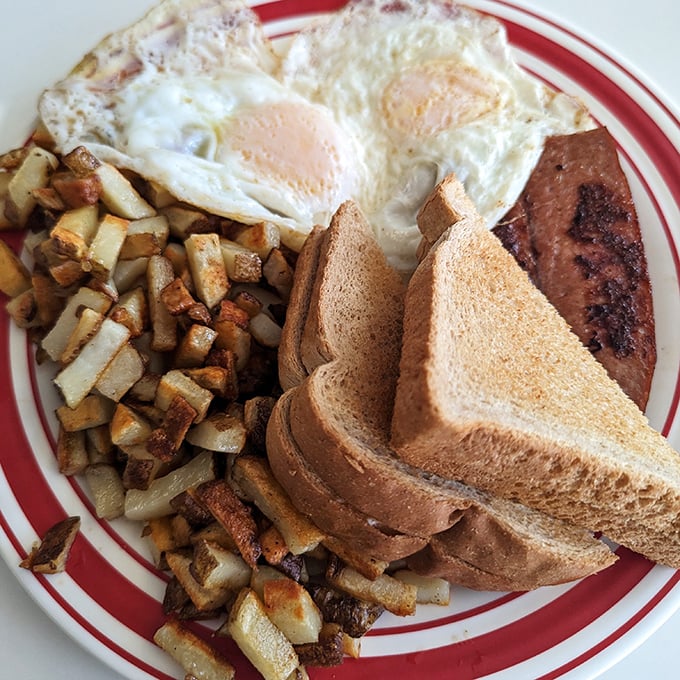 This plate could double as a map of breakfast heaven &ndash; eggs marking true north, toast pointing toward happiness.