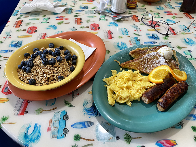 Granola with fresh blueberries alongside French toast and eggs&mdash;proof that balance in breakfast is technically possible.