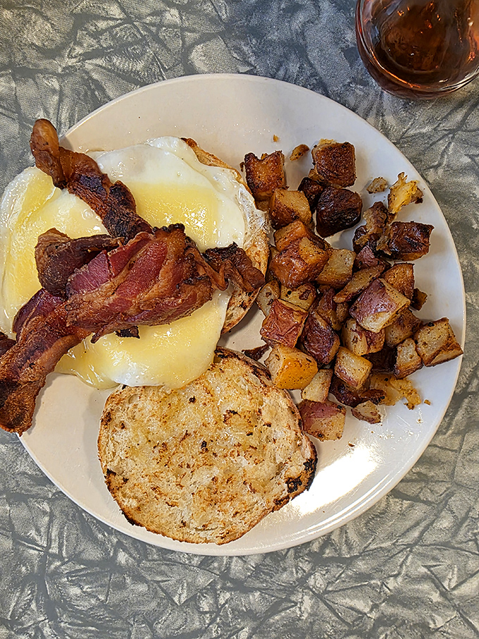 Breakfast nirvana: perfectly cooked eggs, crispy home fries, and that essential cup of diner coffee. The holy trinity of morning happiness.