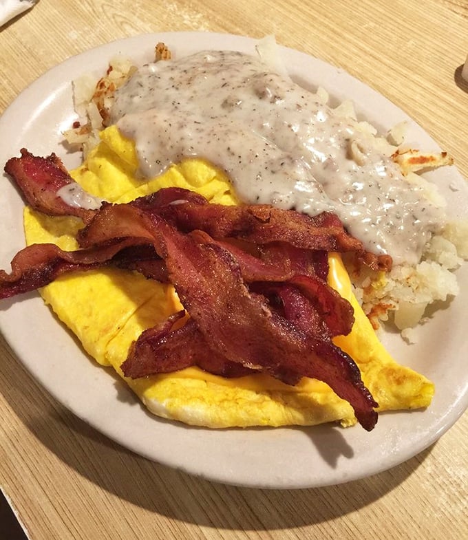 Golden hash browns, perfectly crispy bacon, and fluffy eggs topped with country gravy &ndash; breakfast doesn't need to be complicated.
