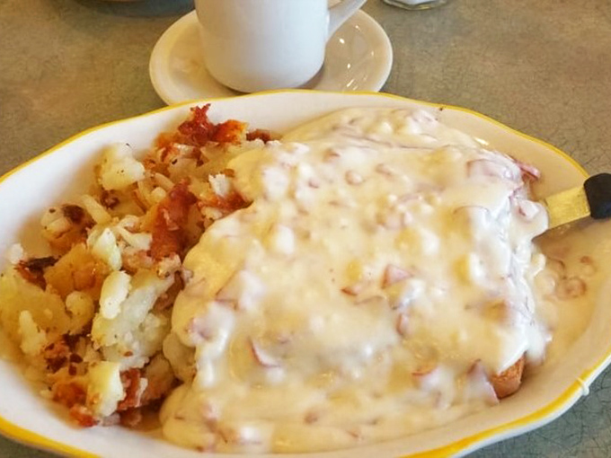 This creamy creation smothers everything in sight &ndash; proof that sometimes the best breakfast philosophy is "when in doubt, add more sauce."