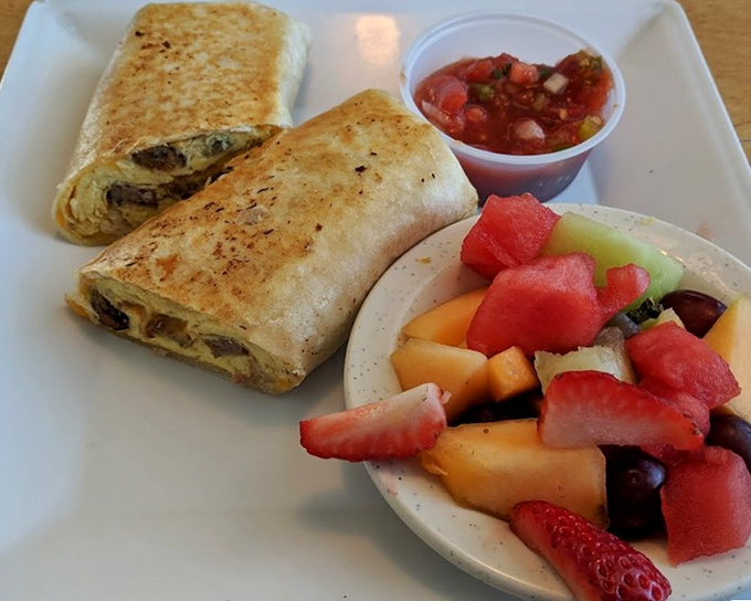 Breakfast burritos that don't need passports to deliver international flavor, served with fresh fruit that looks like it was picked moments ago.