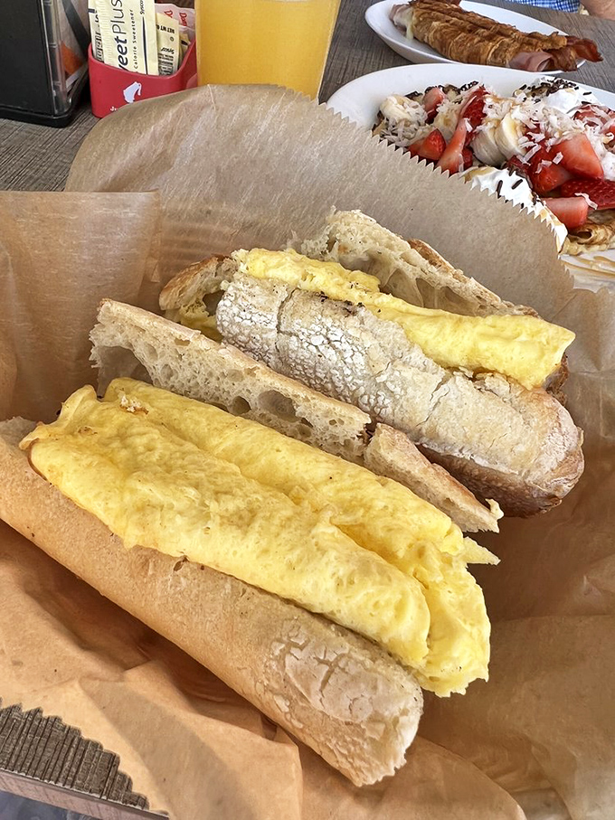 This isn't just an egg sandwich—it's a masterclass in simplicity, with fluffy eggs nestled in a baguette that crackles with each heavenly bite.