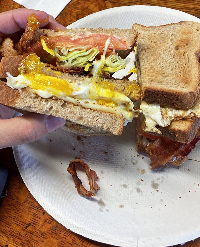 Breakfast sandwich nirvana! Layers of egg, bacon, and cheese nestled between toast &ndash; proof that perfection doesn't require fancy ingredients.