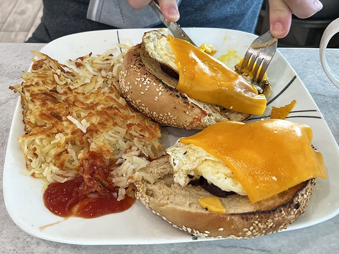 Golden yolks cascading over sesame bagels with hash browns that actually earned their keep &ndash; breakfast done absolutely right here.