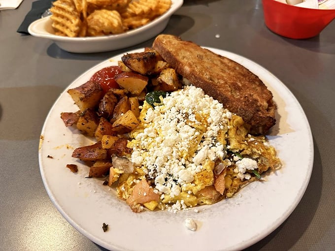 Scrambled eggs mingling with home fries and feta&mdash;a breakfast affair to remember. Toast stands by, ready for that perfect supporting role.