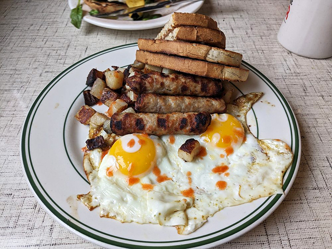 Breakfast that means business. Those sunny-side-up eggs with perfectly crispy edges are giving the sausage links a run for their money.