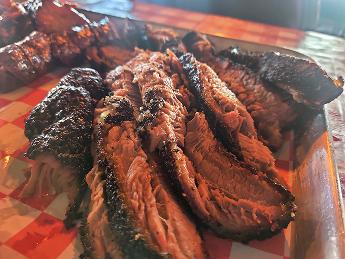 Brisket slices that make you want to write poetry&mdash;each with that perfect pink smoke ring that BBQ aficionados dream about at night.
