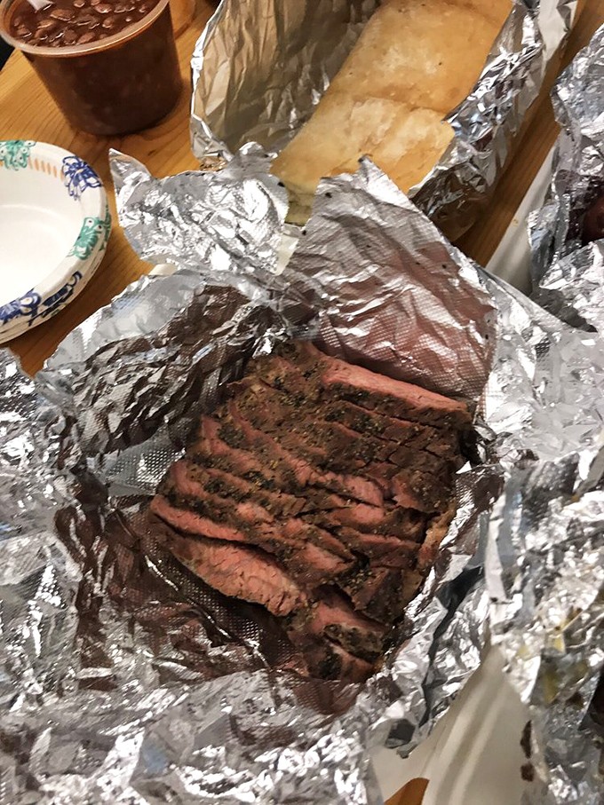Brisket that's been kissed by smoke for hours reveals its pink ring of honor &ndash; the barbecue equivalent of Olympic gold &ndash; tender enough to cut with a stern look.