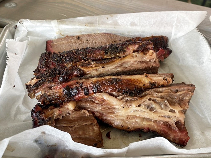 Behold the brisket&mdash;that smoke ring is the BBQ equivalent of a Rolex. Each slice tells the story of patience, smoke, and a pitmaster who knows exactly what they're doing.