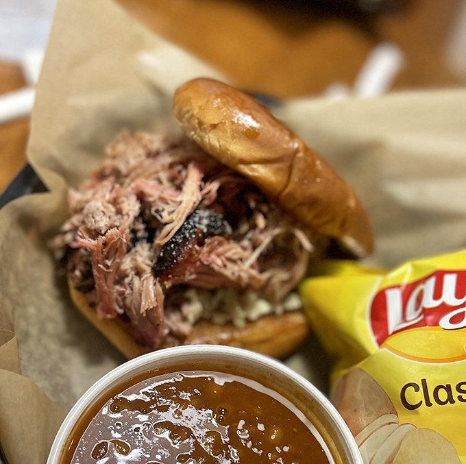 This brisket sandwich isn't just a meal, it's a religious experience. The smoke ring alone deserves its own fan club.