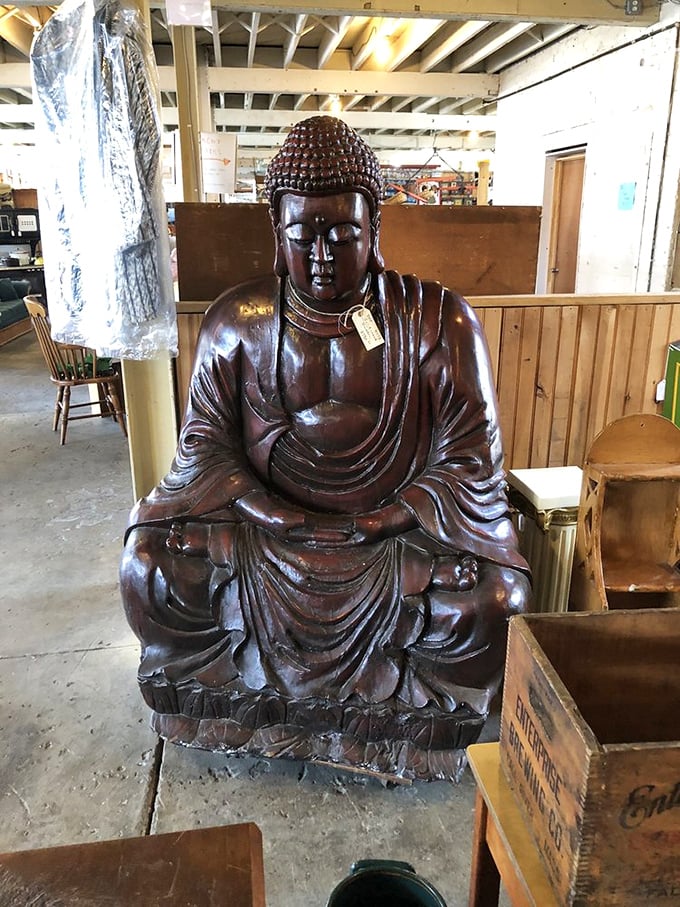 This wooden Buddha doesn't just sit in silent meditation—he's witnessed decades of shoppers searching for enlightenment through vintage treasures.