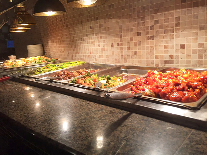 Dishes glistening under warm lights, the kind of buffet spread that makes you realize you&rsquo;re definitely going back for round two.