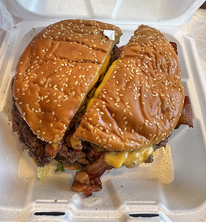 This isn't just a burger &ndash; it's edible architecture with a sesame seed roof, where beef and cheese create the perfect neighborhood for bacon to live.