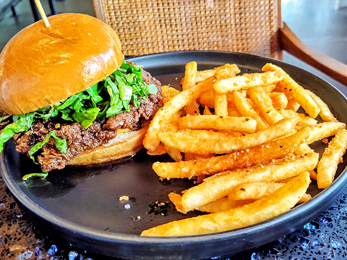 This burger doesn't just satisfy hunger&mdash;it obliterates it. The crispy golden fries are the perfect sidekick to this meaty masterpiece.