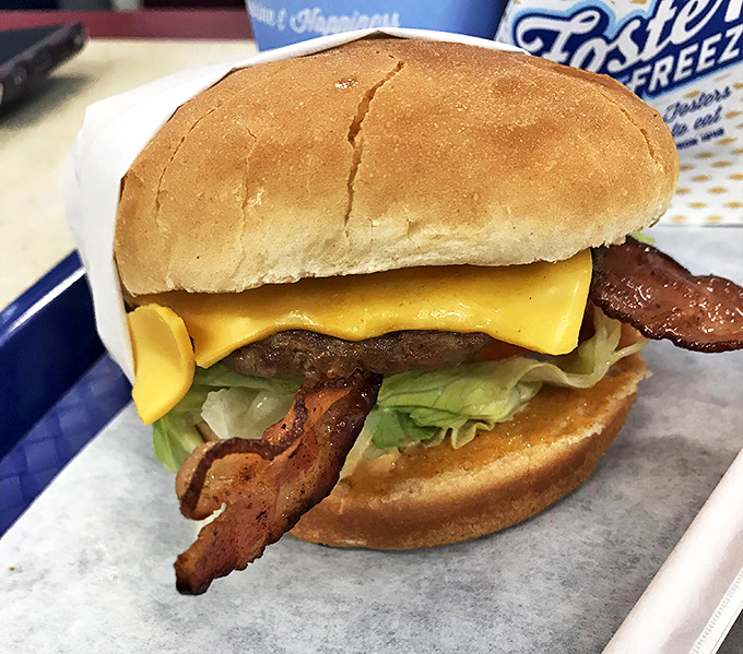 This bacon cheeseburger achieves what scientists call "perfect cheese melt" – a phenomenon worthy of its own documentary series.