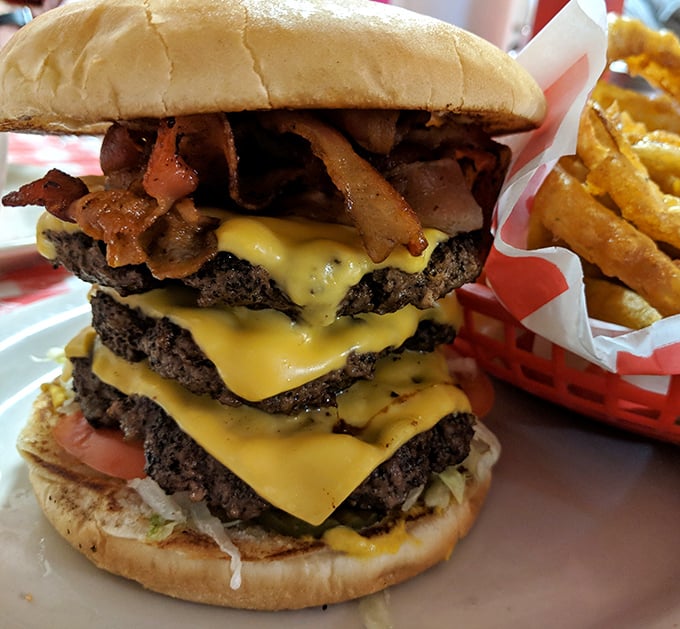 Behold the Mega Mel burger - an engineering marvel that challenges both your appetite and your jaw's capabilities.