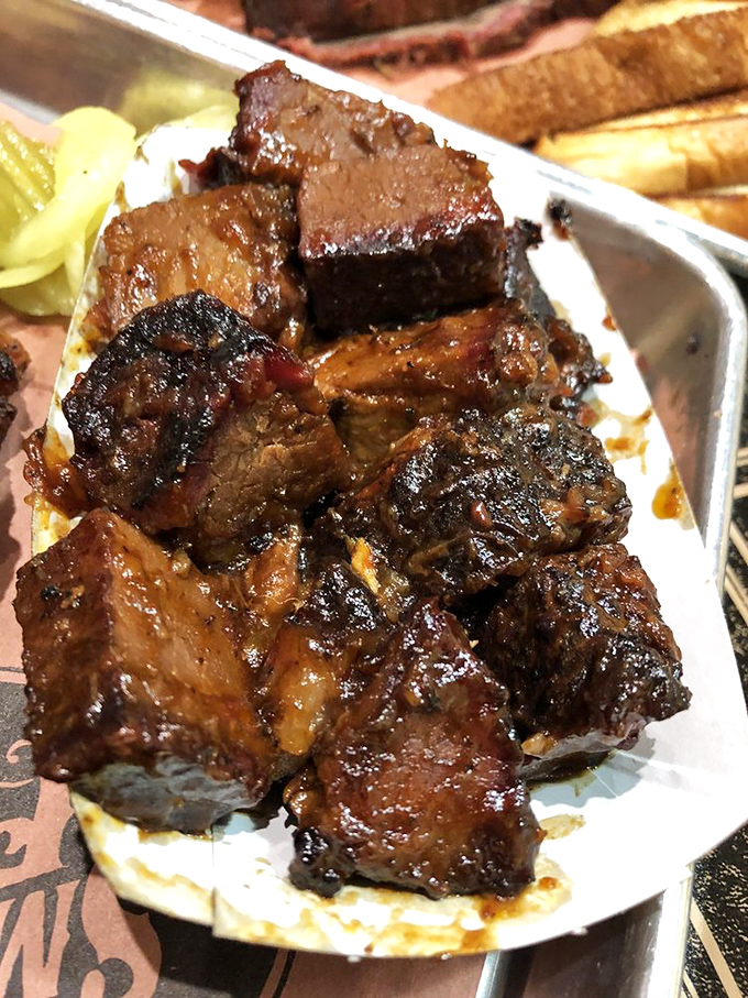These burnt ends aren't just meat &ndash; they're caramelized flavor bombs that would make even vegetarians question their life choices.