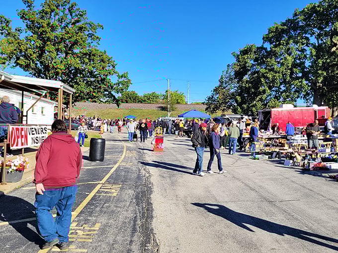 Fall brings out the serious shoppers. Bundled bargain hunters navigate the market's winding paths like seasoned explorers on a mission.