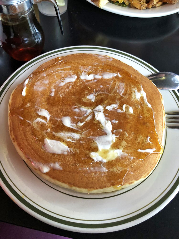 Behold the pancake in its natural habitat&mdash;golden, fluffy, and swimming in a pool of melted butter and maple syrup. Resistance is futile.