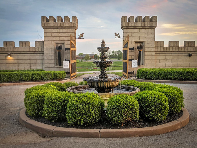 A bubbling fountain welcomes visitors through the castle gates, where even your minivan feels like a royal carriage upon arrival.