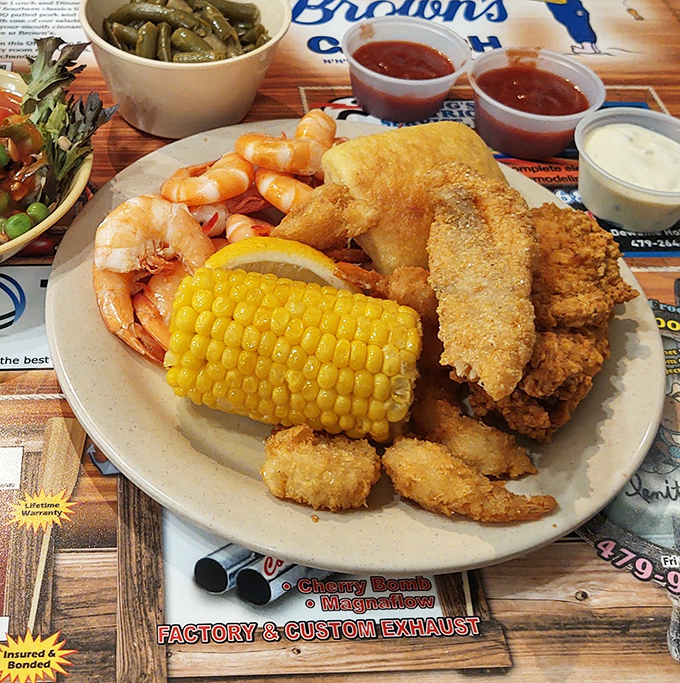 A plate that answers the eternal question: "Why choose?" Golden-fried catfish, plump shrimp, and sweet corn on the cob create the holy trinity of Southern seafood satisfaction.