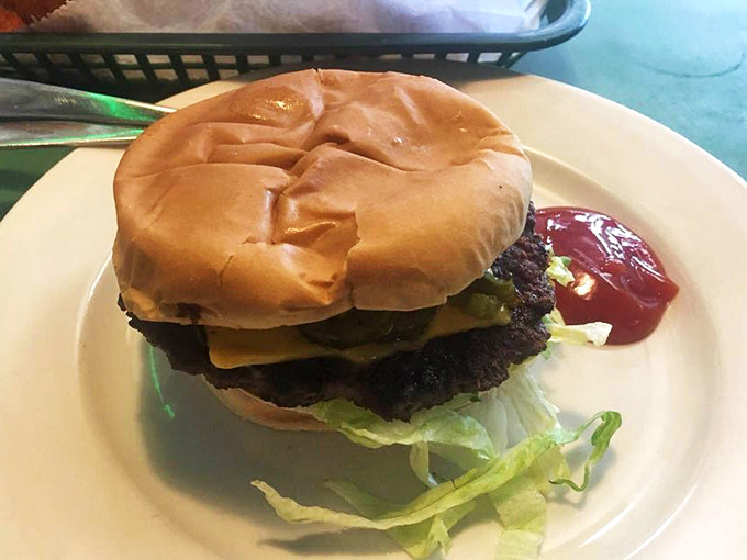 Behold the star of the show: a no-nonsense cheeseburger that doesn't need fancy aioli or artisanal buns to make you close your eyes in appreciation.