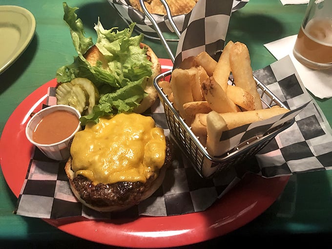 Cheese cascading down a perfectly seared patty with crispy fries standing at attention &ndash; this is burger artistry at its finest.